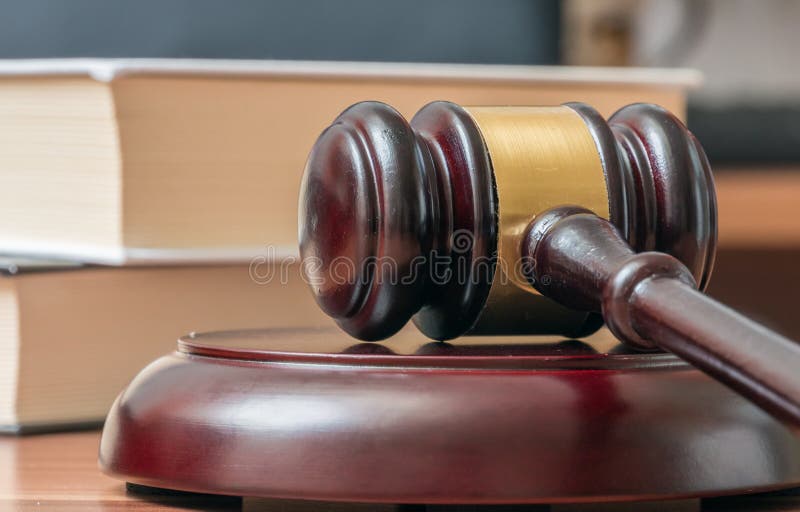 Auction Gavel with Books in Background. Justice and Auction Concept ...