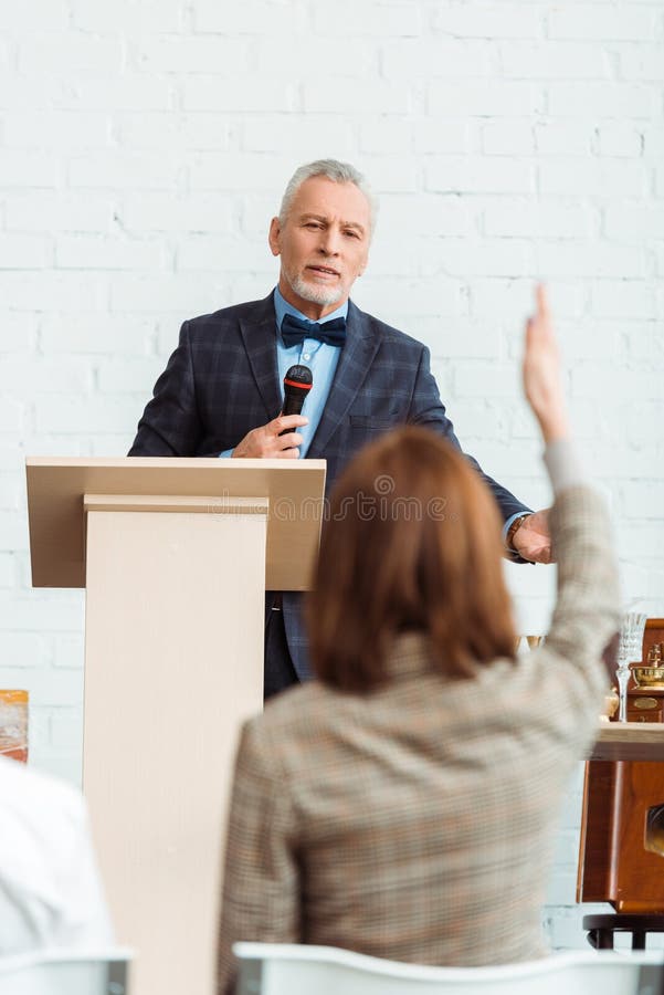 Auctioneer Talking with Microphone and Holding Stock Image - Image of ...