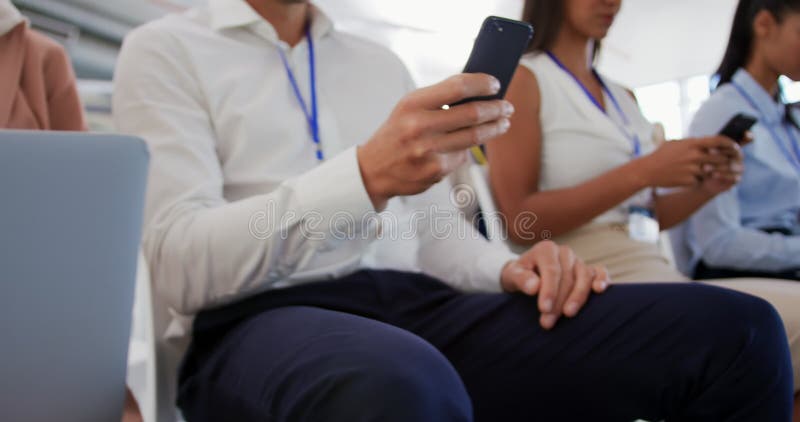 Audience at a Business Conference Using Phones and Computers Stock ...