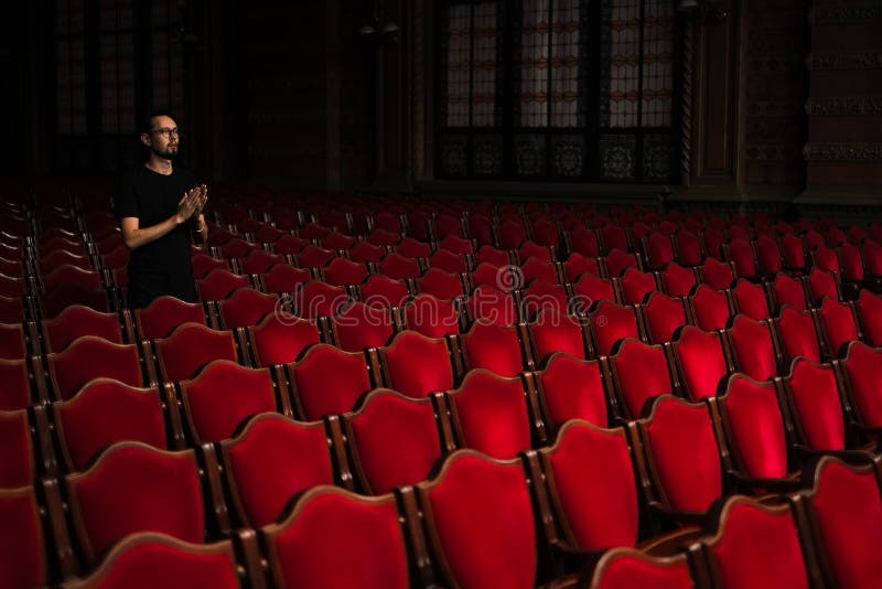 A Male Spectator in an Empty Concert Hall Applauds Standing Stock Photo ...