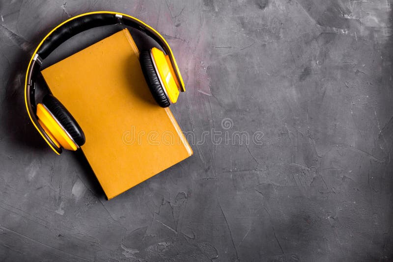 Audio Book Concept with Headphones on Grey Table from Above Copy Space ...