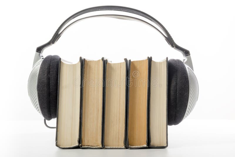 Audio Book Stack of Hardback Books and Electronic Reader. Electronic ...