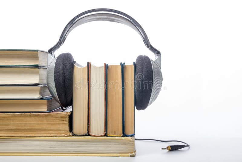 Audio Book Stack of Hardback Books and Electronic Reader. Electronic ...