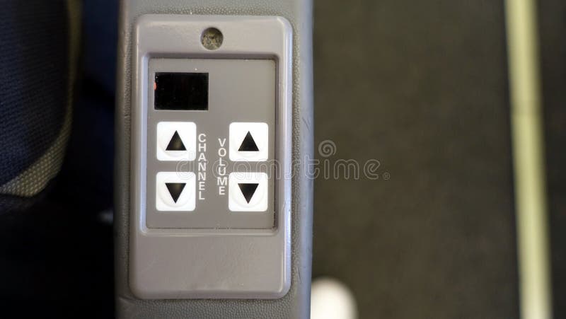 Audio Control on an Armrest of an Airplane Chair. Stock Image - Image ...