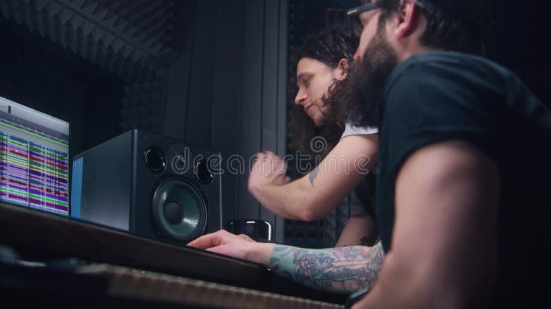 Audio Engineer and Male Singer Create Song in Recording Studio Stock ...