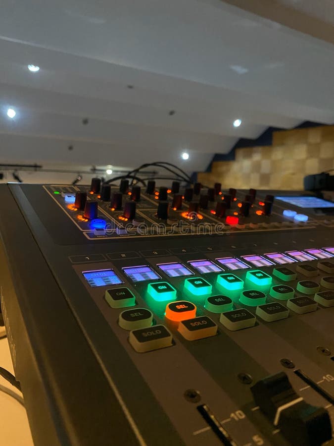 Audio Mixing Console with a Variety of Multicolored Knobs and Dials ...