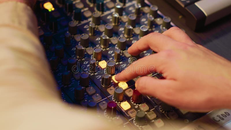 Audio Technician Twisting Pre Amp Knobs and Buttons on Board in Control ...