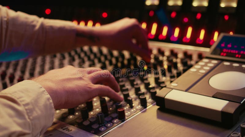 Audio Technician Twisting Pre Amp Knobs and Buttons on Board in Control ...