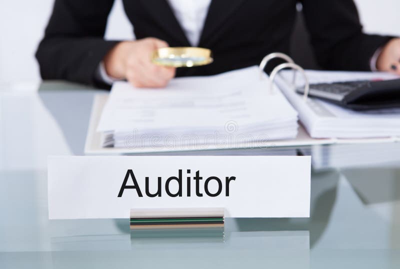 Auditor Scrutinizing Financial Documents Stock Photo - Image of adult ...