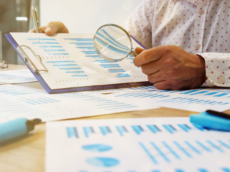 Auditor is Working on Desc Office Using Reading-glass, Statutory Audit ...