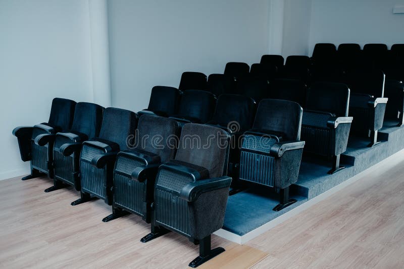 Auditorium with a Lot of Empty Black Chairs Stock Photo - Image of ...