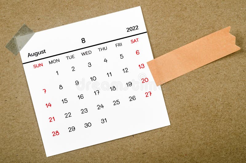 August 2022 Calendar with Blank Adhesive Note Paper on Brown Background ...