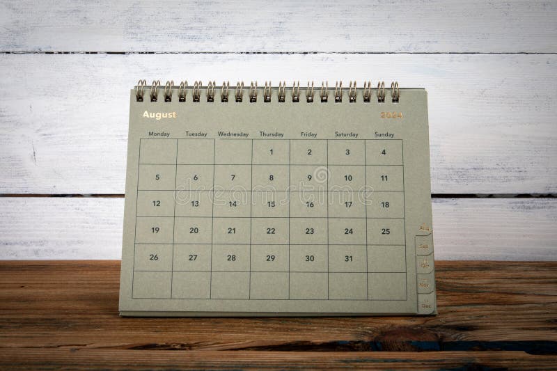 AUGUST 2024 Cardboard Desk Calendar and Planner on a Wooden Texture ...