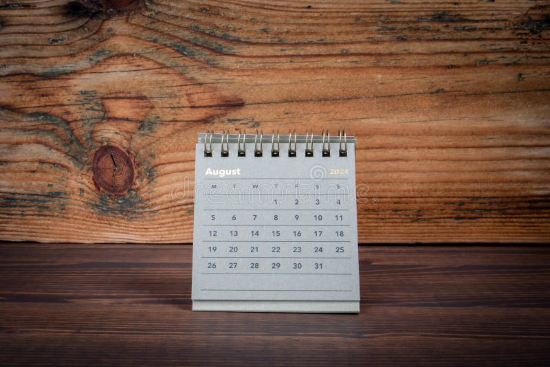 August 2024 Cardboard Desk Calendar on a Wooden Texture Background ...