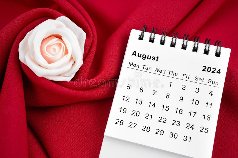 August 2024 Desk Calendar and Pink Rose on Red Textile Stock Image ...