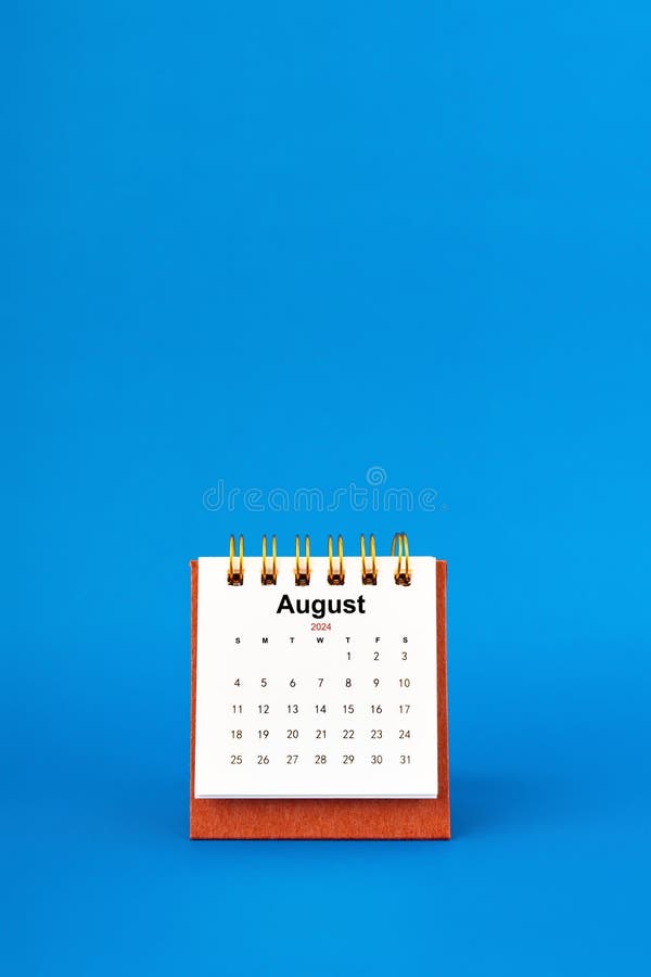 August 2024 White Desk Calendar on Blue Background Stock Photo - Image ...