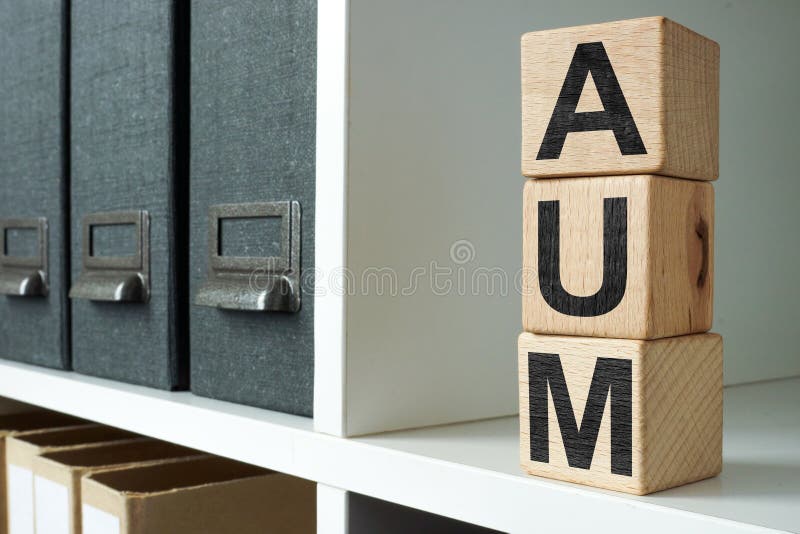 AUM Assets Under Management Blocks on an Office Shelf Symbolizing ...