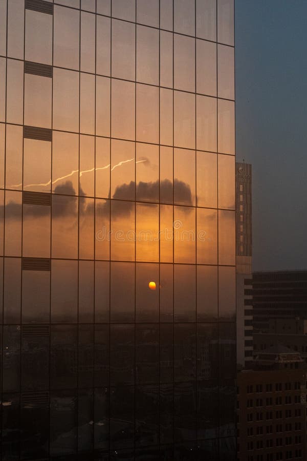 Dramatic Sunrise Reflected in the Windows of a Skyscraper in the ...
