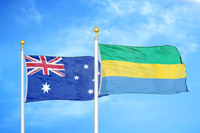 Australia and Gabon Two Flags on Flagpoles and Blue Cloudy Sky Stock ...