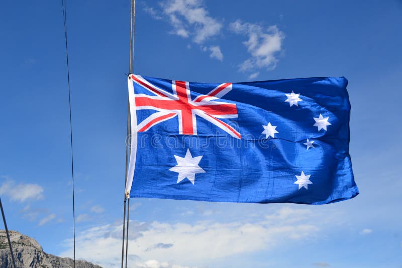 Australian Flag on Blue Sky Stock Image - Image of flying, blowing ...