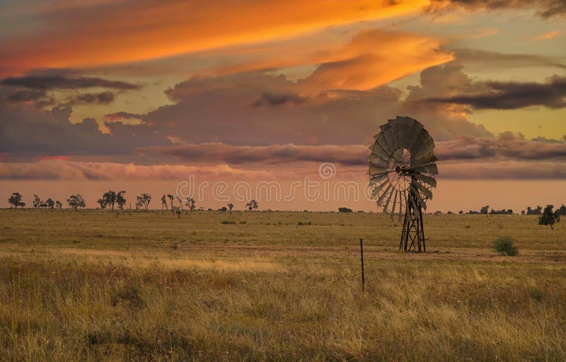 Australian Sunset with a Windmill Stock Photo - Image of country, pump ...