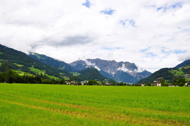 Field with Mountains in Background Stock Photo - Image of grassland ...
