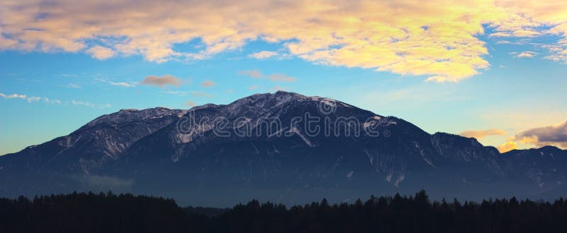 The Austrian Alps with Orange Sky and Clouds Stock Photo - Image of ...