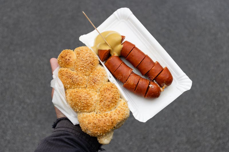 Austrian Sausage with Mustard and Bread Held by a Hand Stock Photo ...