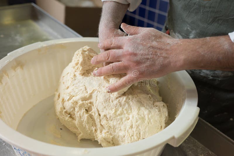 Authentic Baking: a Person S Hands Covered in Flour Kneading Dough for ...