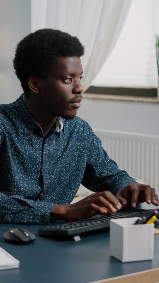 Black Man Computer User Working from Home in Cozy Flat Stock Photo ...