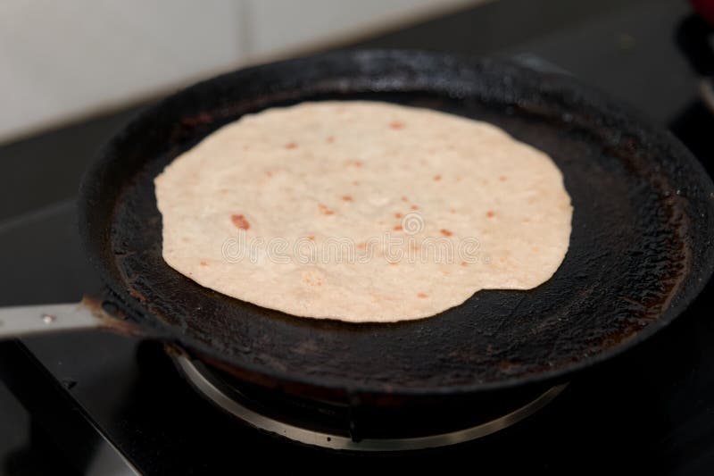 Authentic Chapati Cooking stock image. Image of iron - 327532663