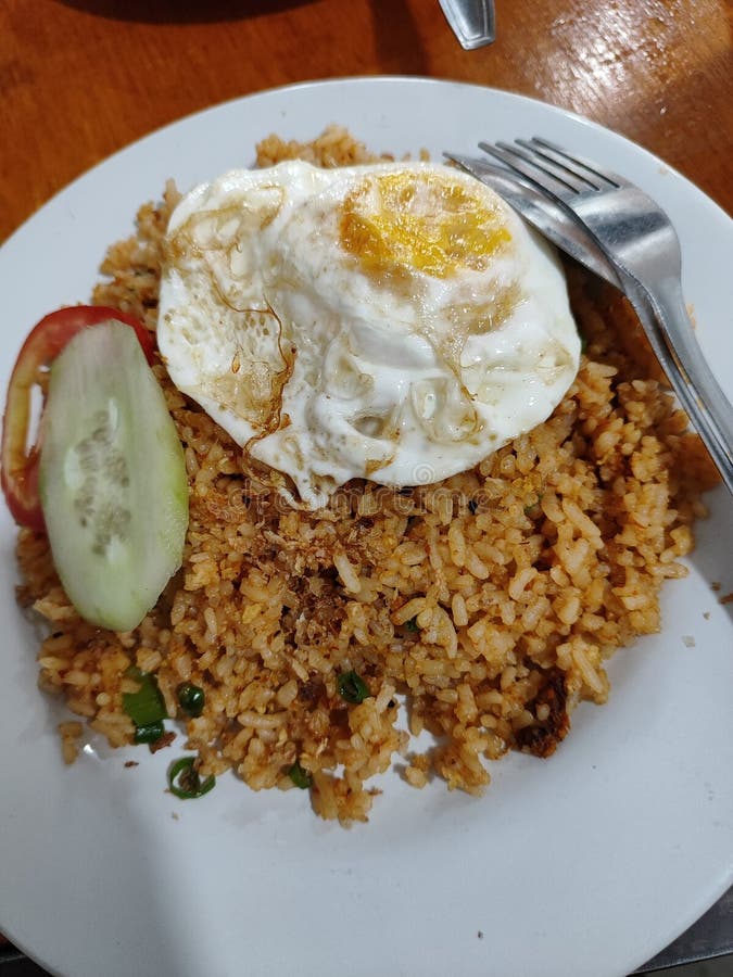 The Authentic Fried Rice from Indonesia with Egg, Tomato, and Cucumber ...