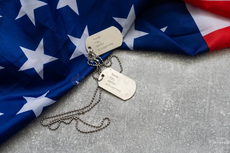 Authentic Military Dog Tag on an American Flag Stock Image - Image of ...