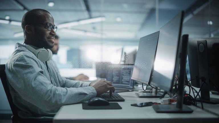 Authentic Office: Portrait of Black it Programmer Working on Desktop ...