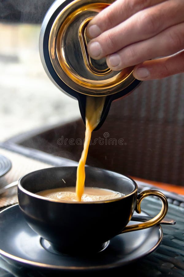 Authentic Pakistani Rich Chai Tea a Pouring into a Stylish Cup Stock ...