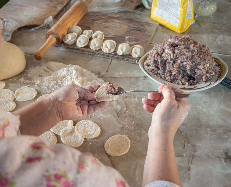 Authentic Photo of Dumpling Making at Home. There is a Dough on the ...