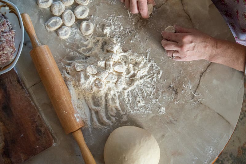 Authentic Photo of Dumpling Making at Home. There is a Dough on the ...
