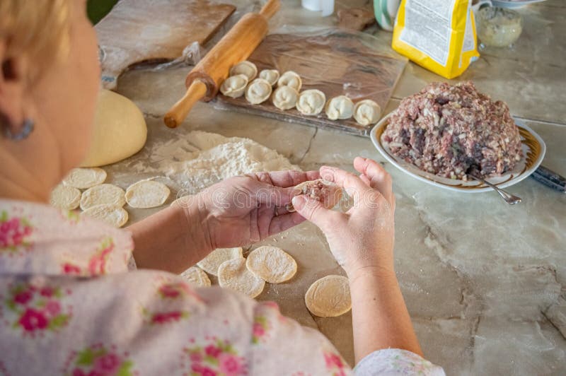Authentic Photo of Dumpling Making at Home. There is a Dough on the ...