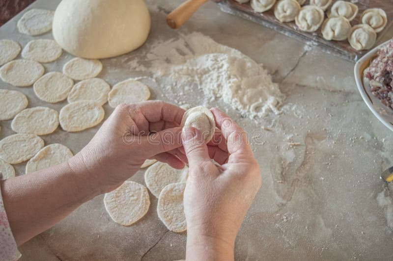 Authentic Photo of Dumpling Making at Home. There is a Dough on the ...