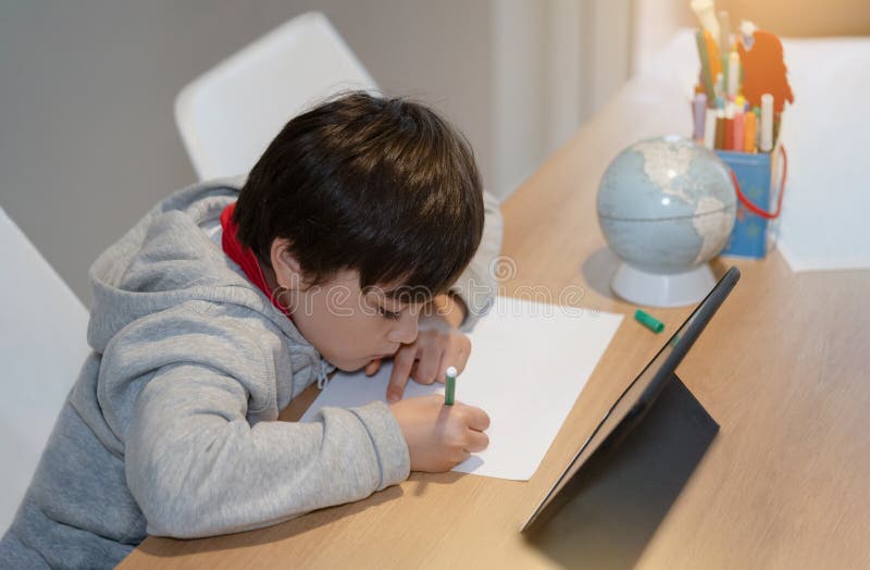 Authentic Portrait Kid Using Tablet for His Homework, Child Doing ...