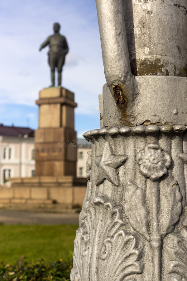 Authentic Retro Decoration on Metal Post with Old Statue in Background ...