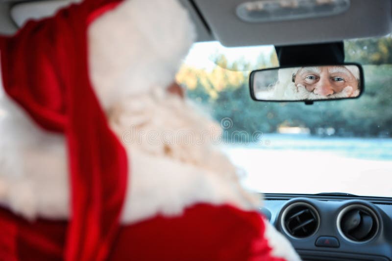 Authentic Santa Claus Looking into Rear View Mirror Inside Stock Photo ...