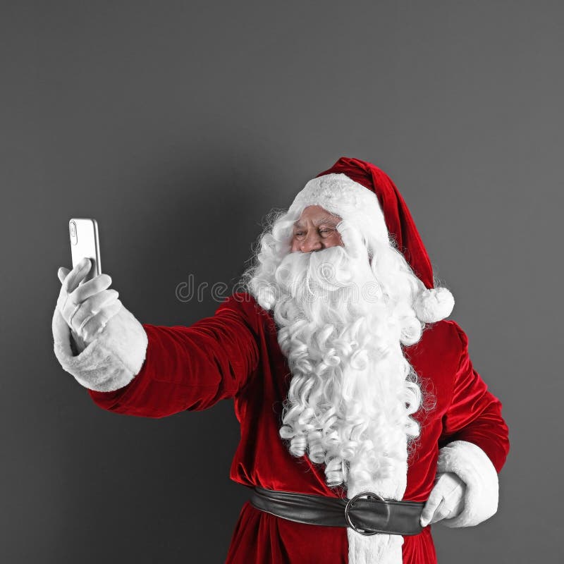 Authentic Santa Claus Taking Selfie on Grey. Space for Text Stock Image ...