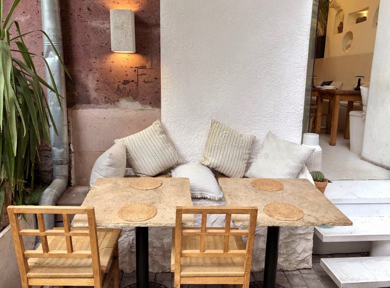 Authentic Street Cafe Exterior with Tables, Chairs and Pillows Stock ...