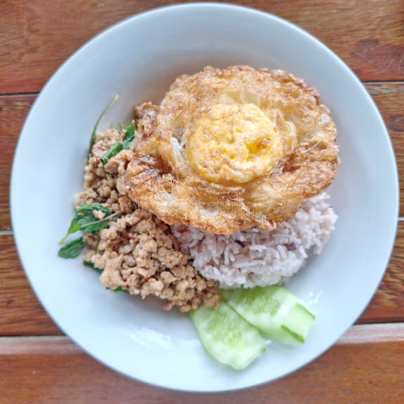 Authentic Thai Basil Pork with Rice and Crispy Fried Egg Stock Photo ...