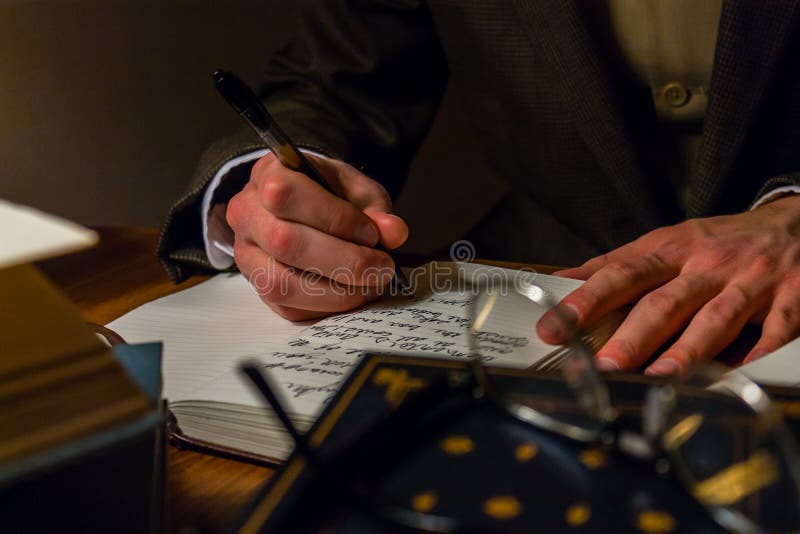 Author Writing in a Journal Taking Notes about Stories or Ideas Stock ...