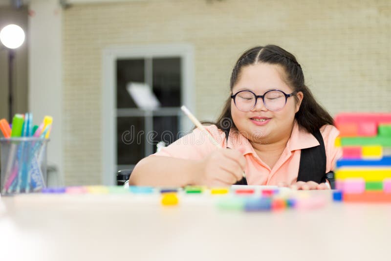 Autistic Girl Enjoys Playing with Toys at Home Stock Image - Image of ...