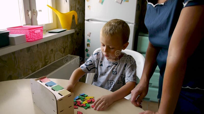 Autistic Arranges Objects by Colors_clup3 Stock Footage - Video of ...