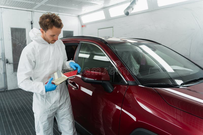 Auto Colorist Selects Car Paint Color with Samples. Stock Image - Image ...