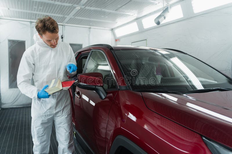 Auto Colorist Selects Car Paint Color with Samples. Stock Photo - Image ...